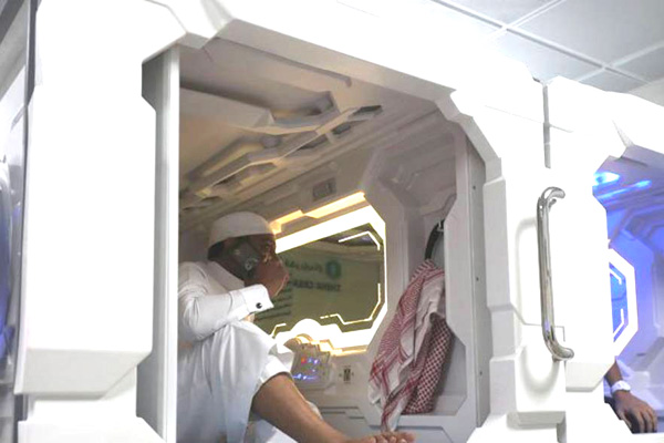 A pilgrim trialing the nap pod. Image: Mubasher