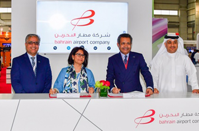 The minister (right) and other officials at the signing.