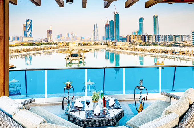 Reef Clubhouse & Lagoon Beach overlooking the Manama skyline