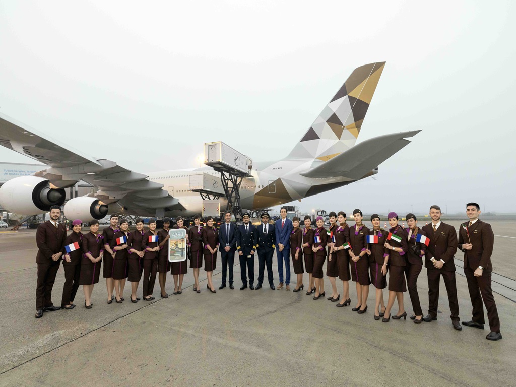 The Etihad team with the A380 aircraft in the background