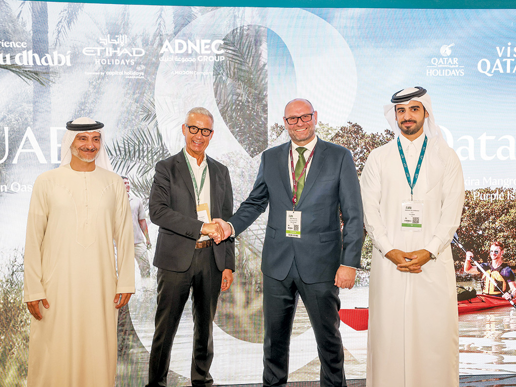Qatar Tourism and DCT Abu Dhabi officials at the signing